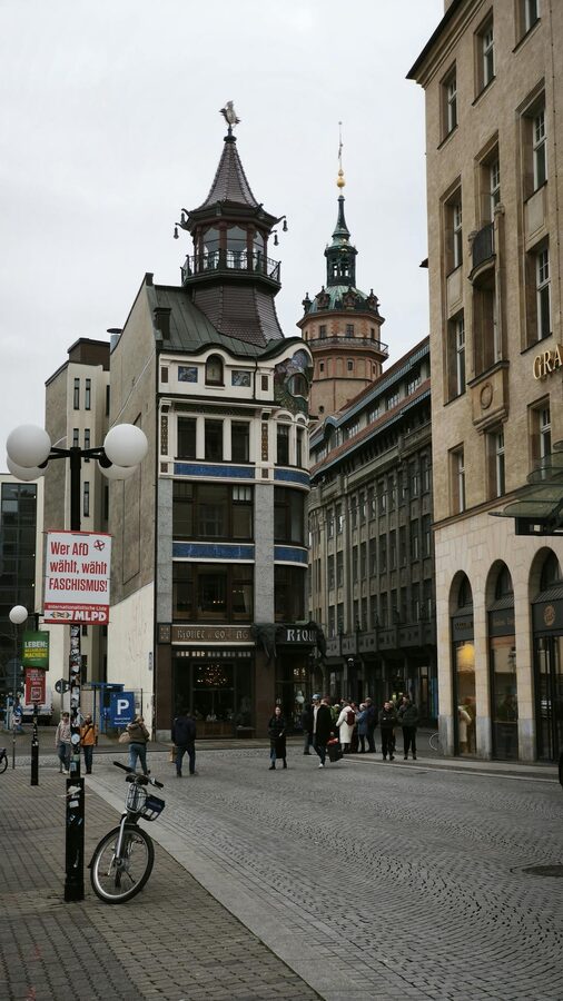 Leipzig city street with classic architecture and pedestrians
