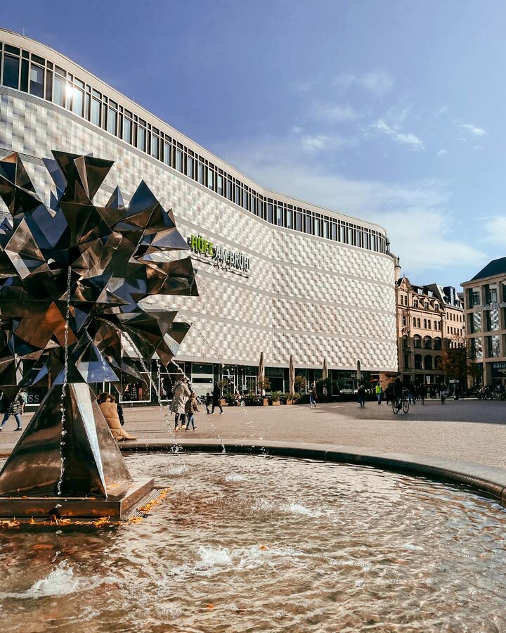 Modern architecture and fountain at Hofe am Bruhl shopping center in Leipzig