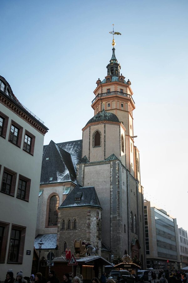 Tower of St Nicholas Church in Leipzig Germany against blue sky