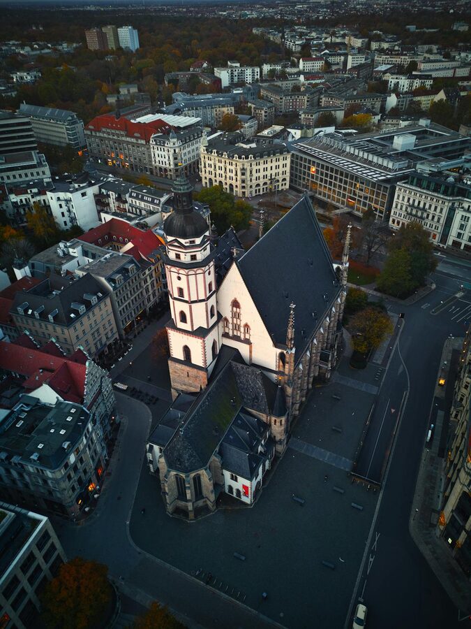 Aerial view of St Thomas Church in Leipzig Germany surrounded by city buildings