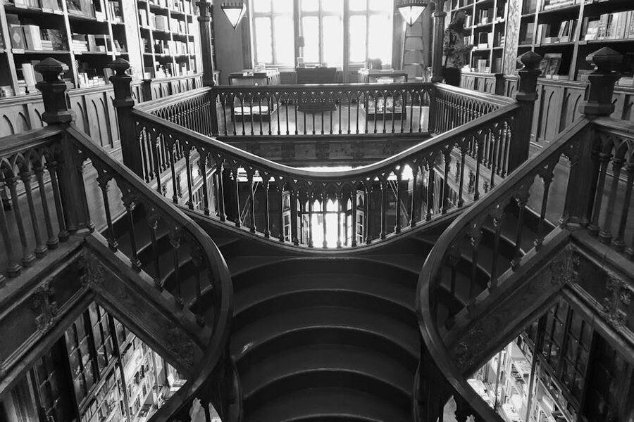 Intricate wooden staircase Livraria Lello Porto