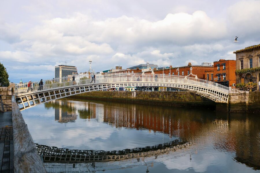 Ha'penny Bridge reflected in the River Liffey at dusk