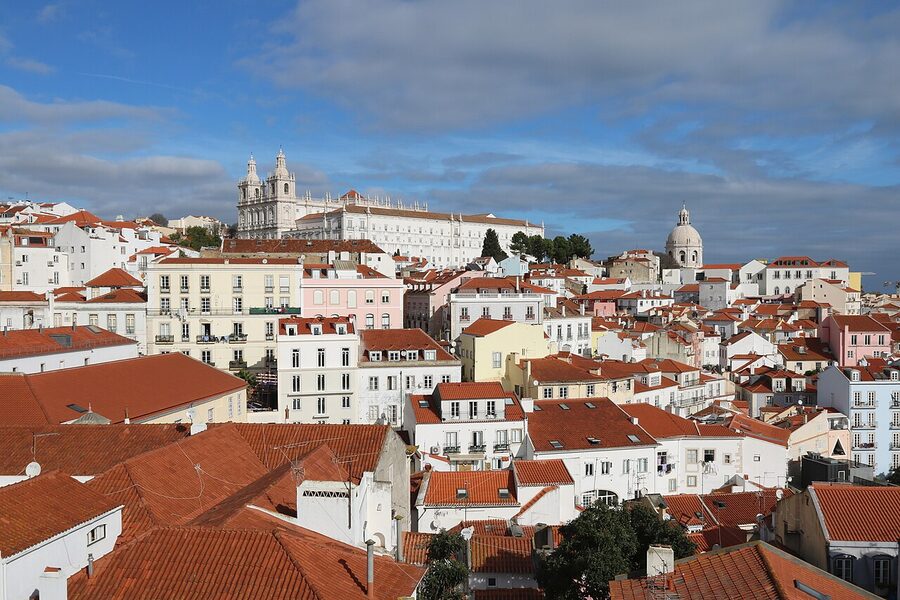 View of Alfama rooftops and São Vicente church from Miradouro de Santa Luzia in Lisbon
