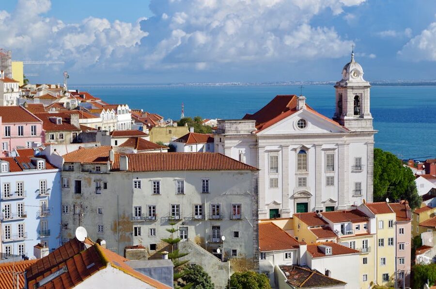 Pastel buildings and narrow street in Alfama old town Lisbon
