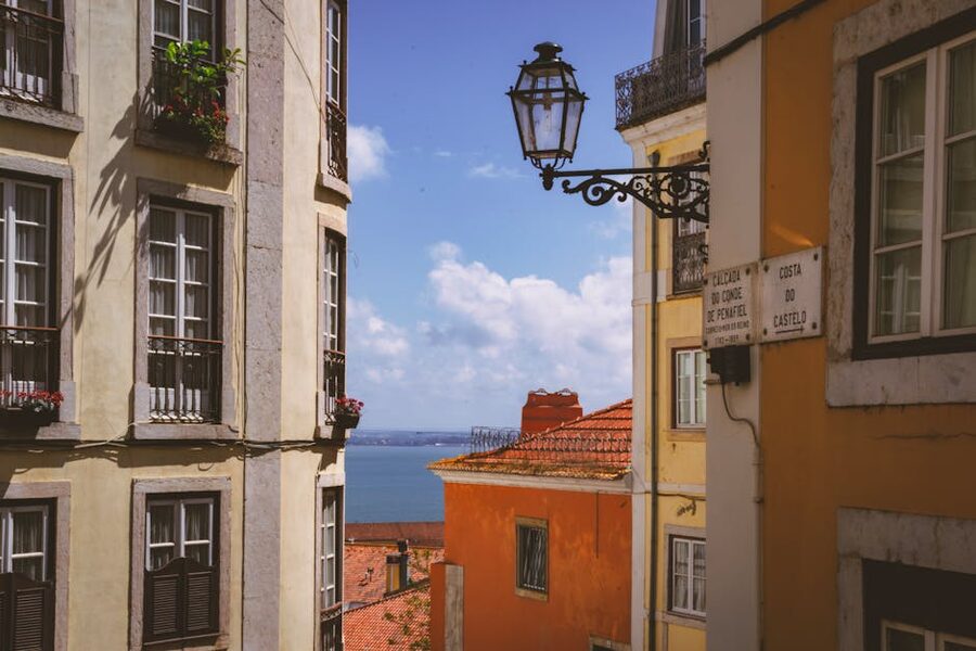 Alfama rooftops with distant Tagus estuary view in Lisbon