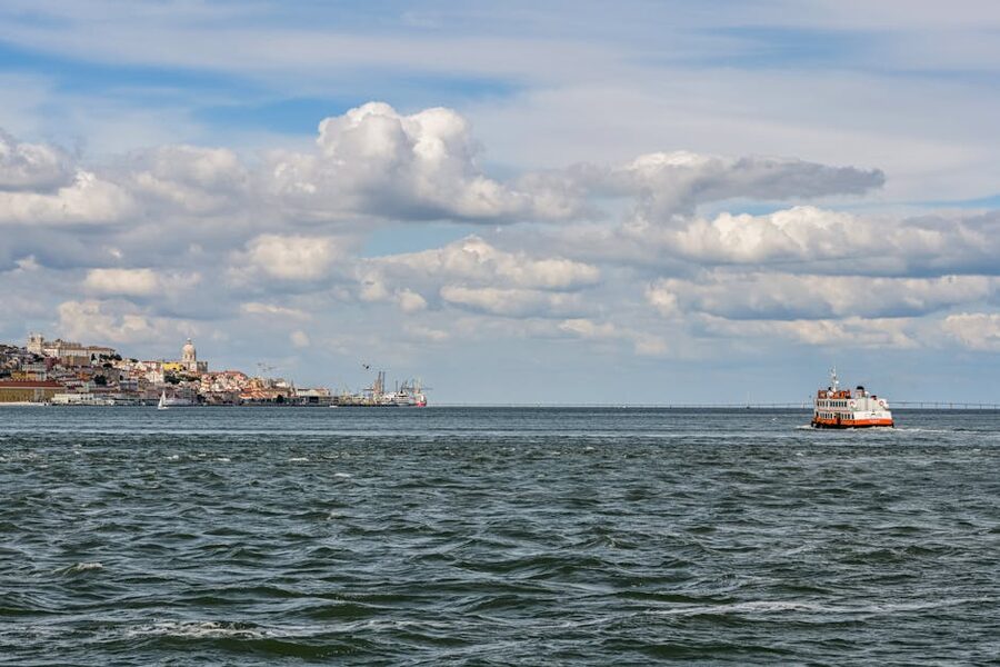 Ferry crossing the Tagus with Lisbon skyline behind