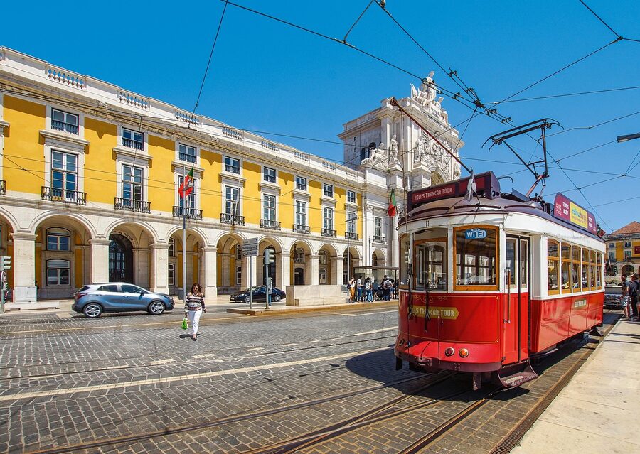 Yellow tram in the Alfama cityscape of Lisbon