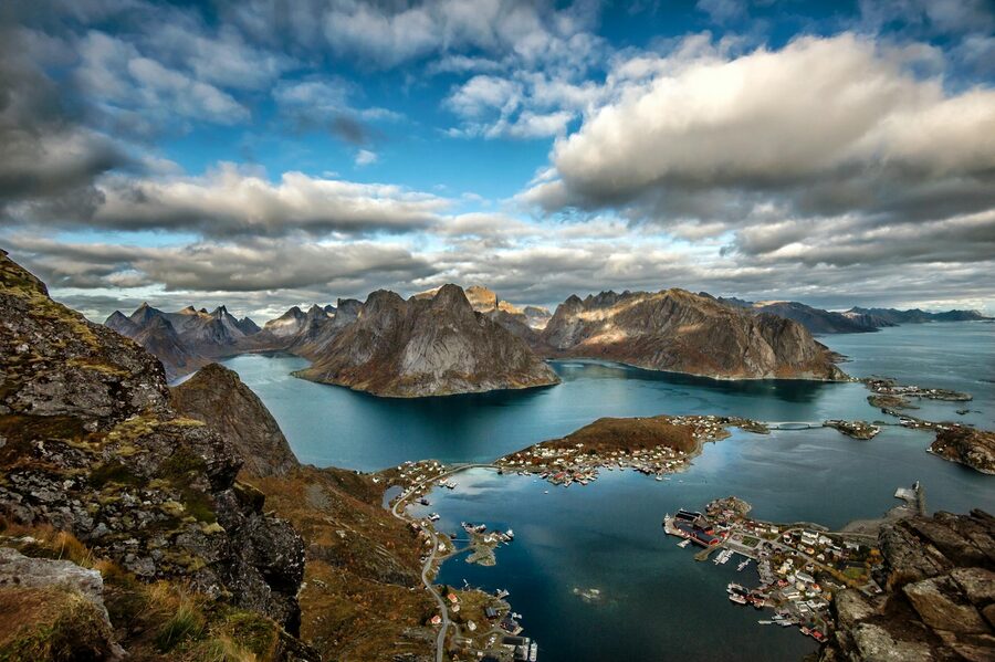 Aerial view of the Lofoten Islands showing dramatic mountains rising from the sea