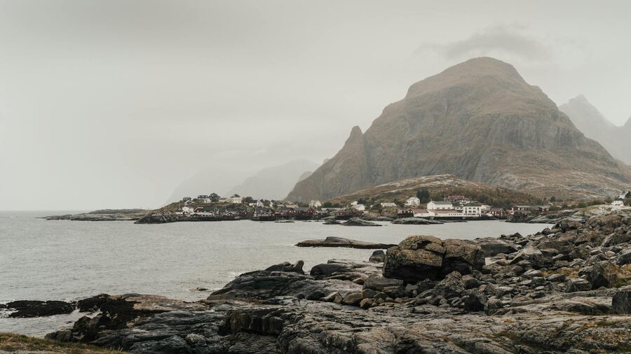 Lofoten Islands fishing harbour with dramatic clouds and mountains