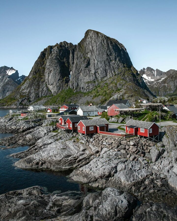 Norwegian village by the sea in Lofoten with mountain backdrop