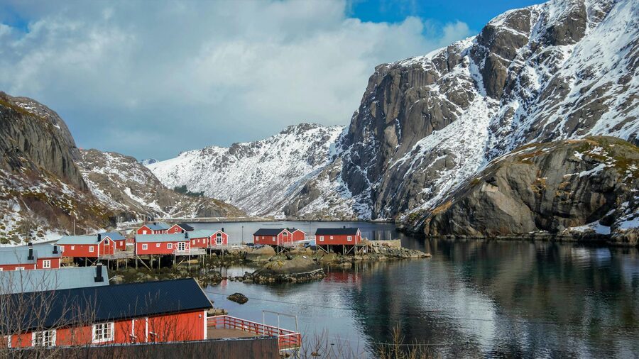 Red cabins in snow-covered Nusfjord, Lofoten