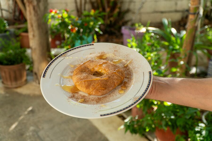 Sweet loukoumades Greek honey donuts with drizzle