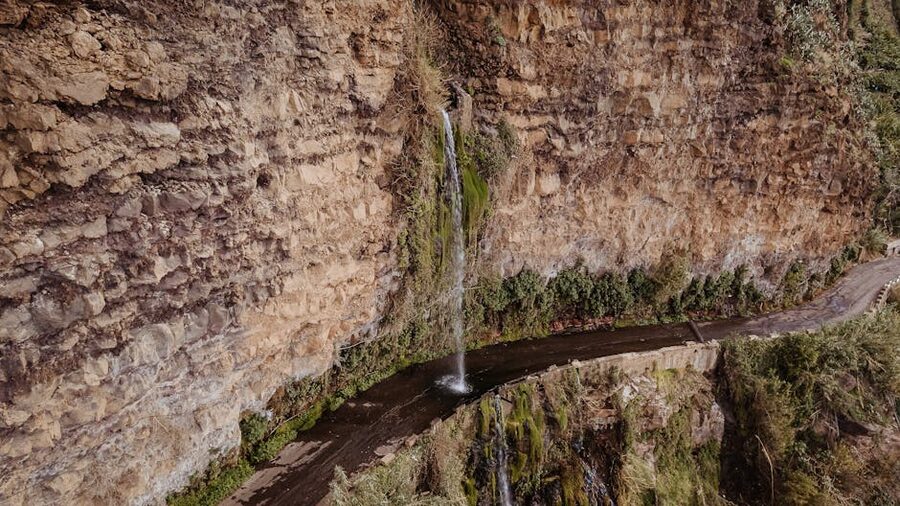 Madeira waterfall beside mountain road