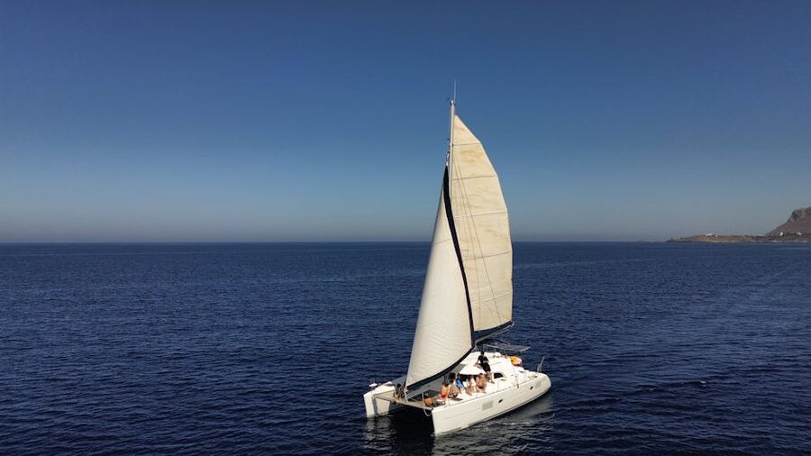 Catamaran on open sea with clear sky