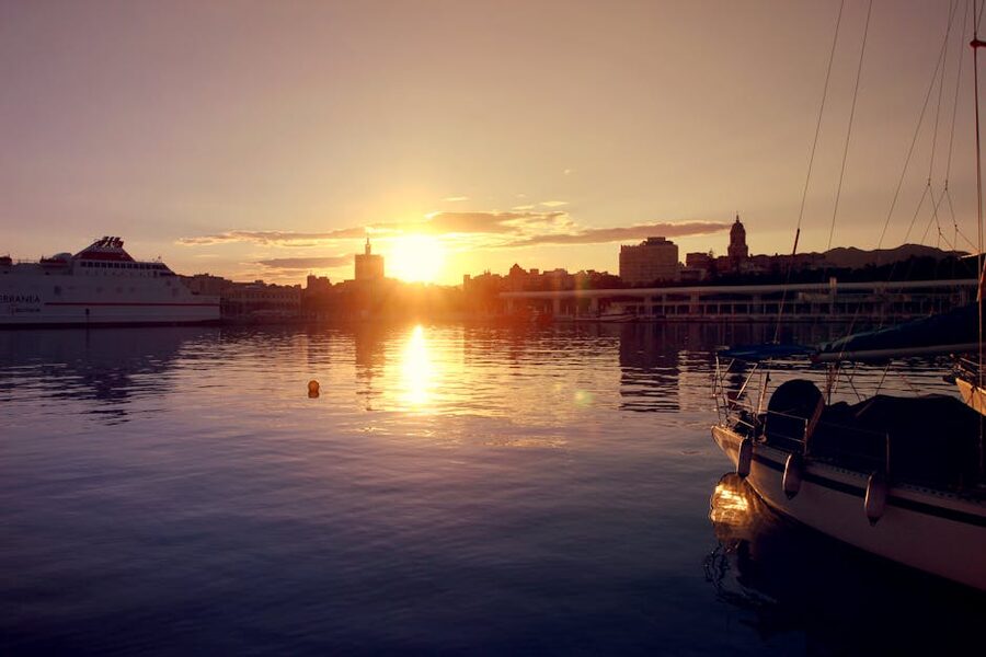 Malaga port at sunset with boats