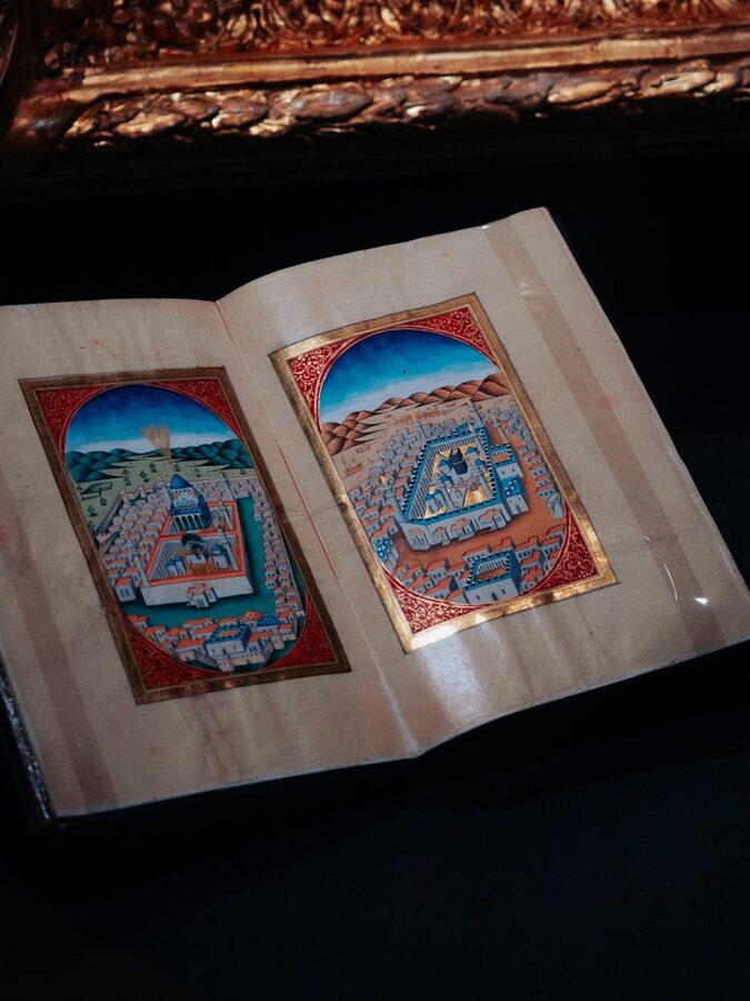 Ancient manuscript page with medieval illustrations of historical figures