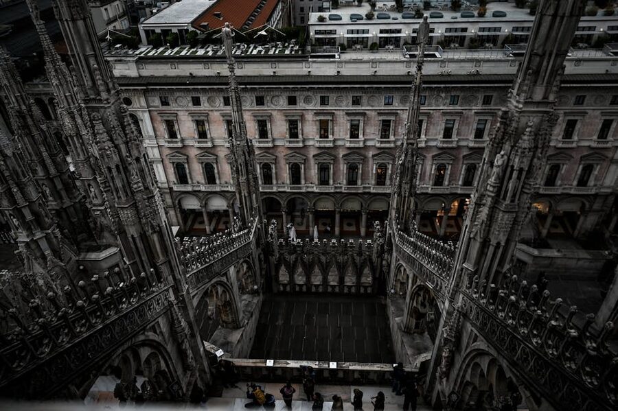 Aerial view of Milan Duomo Gothic spires and statues