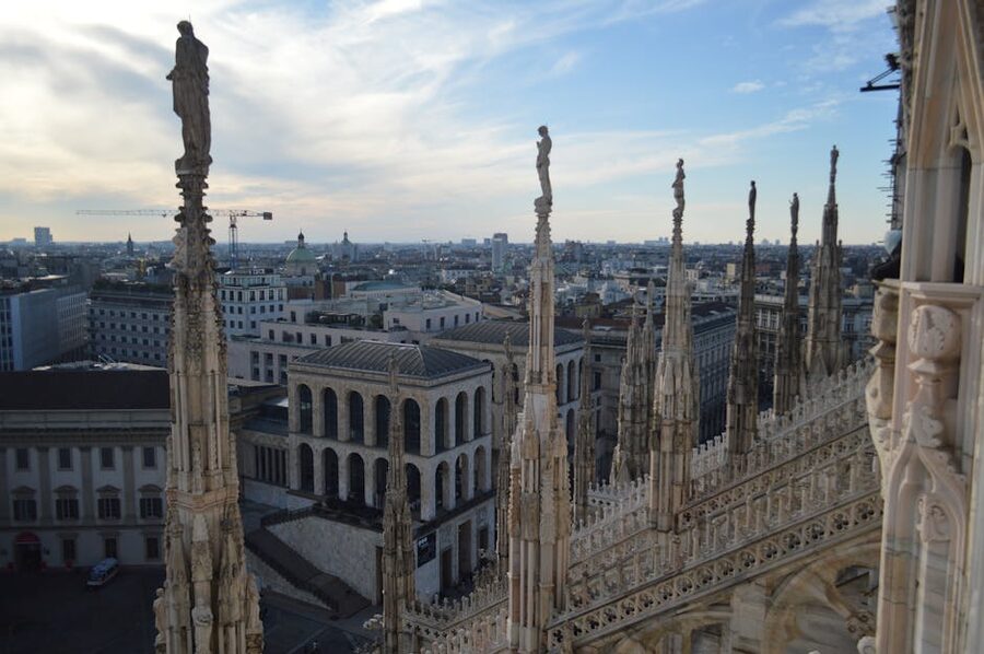 Milan Duomo rooftop terrace view with ornate Gothic architecture