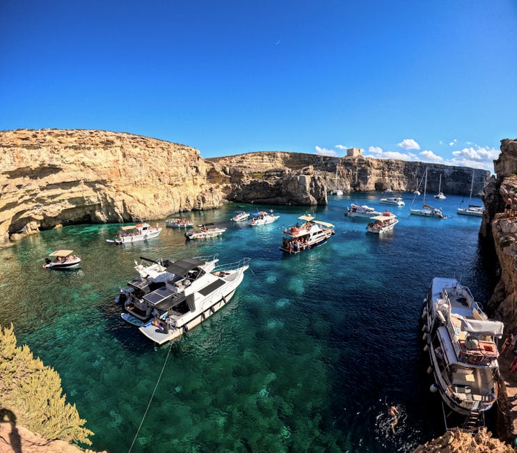 Aerial view of the Blue Lagoon in Malta showing boats and clear waters from above