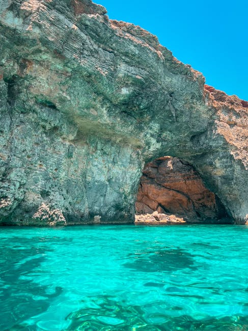 Turquoise waters and rugged caves at Comino island, Malta