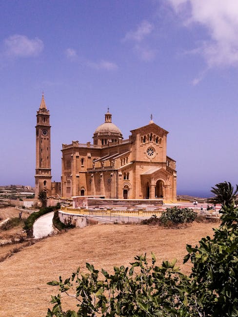 Ta' Pinu Basilica in Gozo with ornate facade against a clear sky