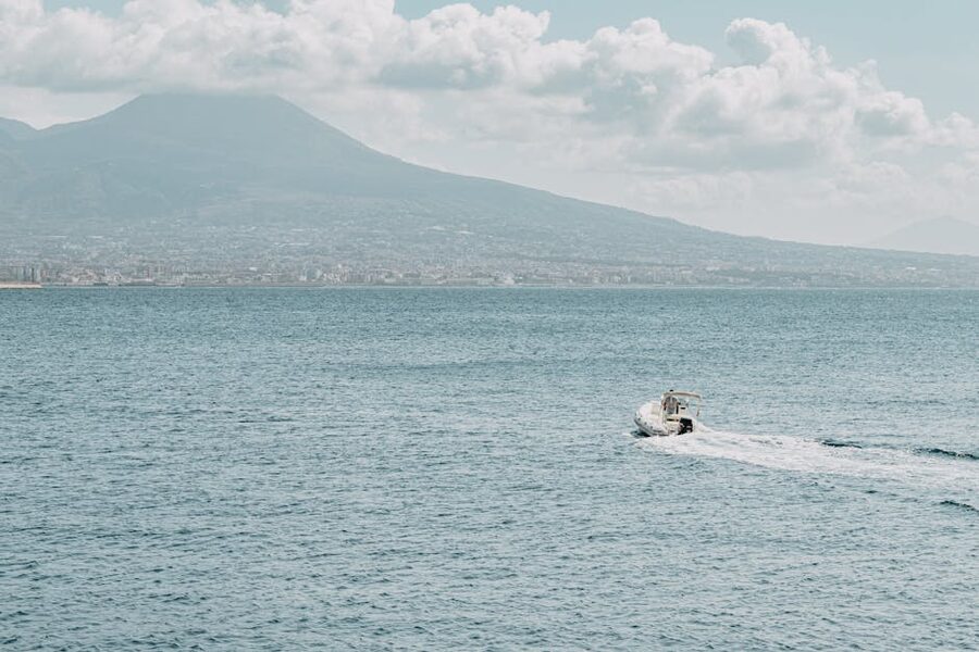 Motorboat on Naples bay with Vesuvius