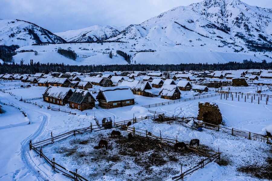 Mountain village with snow-covered peaks