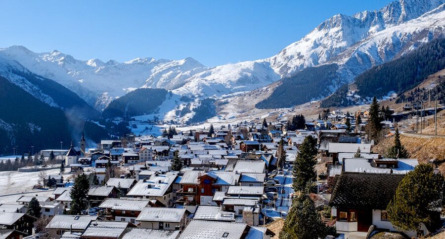 Mountain village with snow-covered peaks and chalets