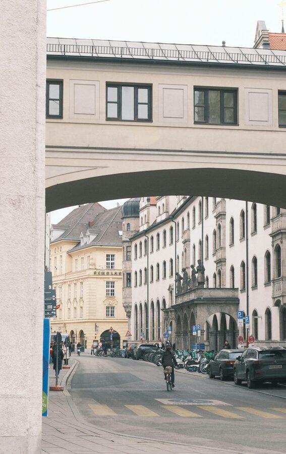 Historic street in Munich with traditional Bavarian architecture and pedestrians