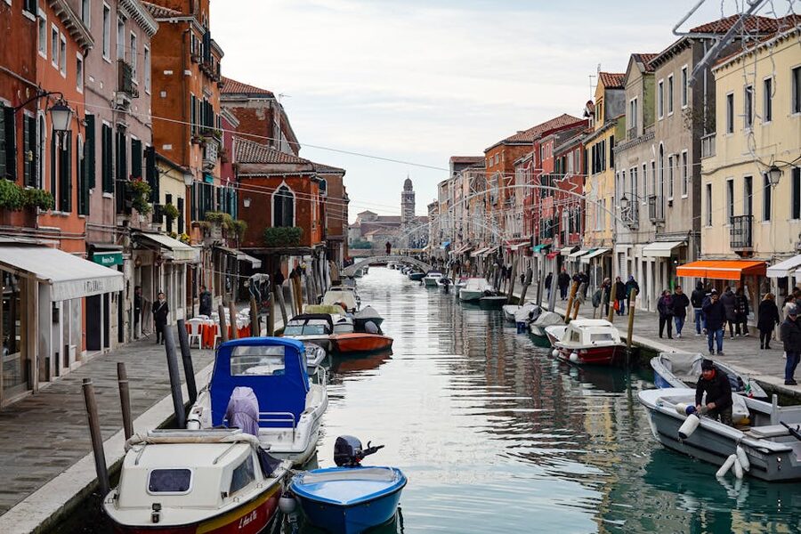Murano canal with boats and houses