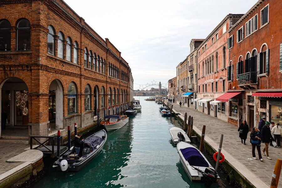 Canal in Murano with historic architecture and moored boats