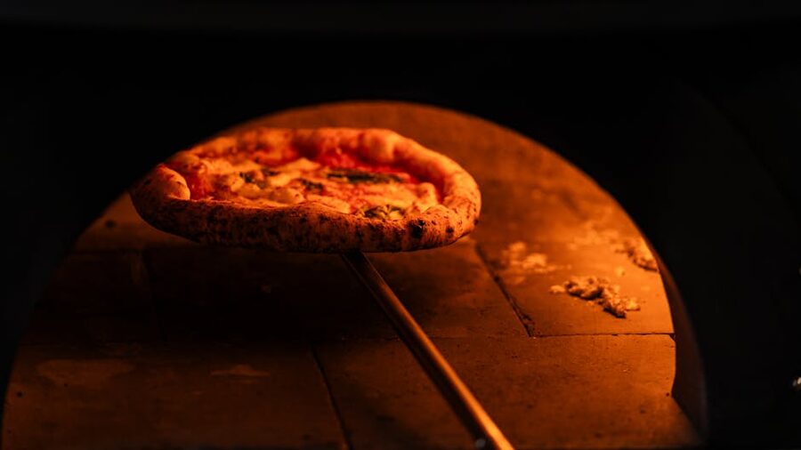 Neapolitan pizza in rustic wood oven