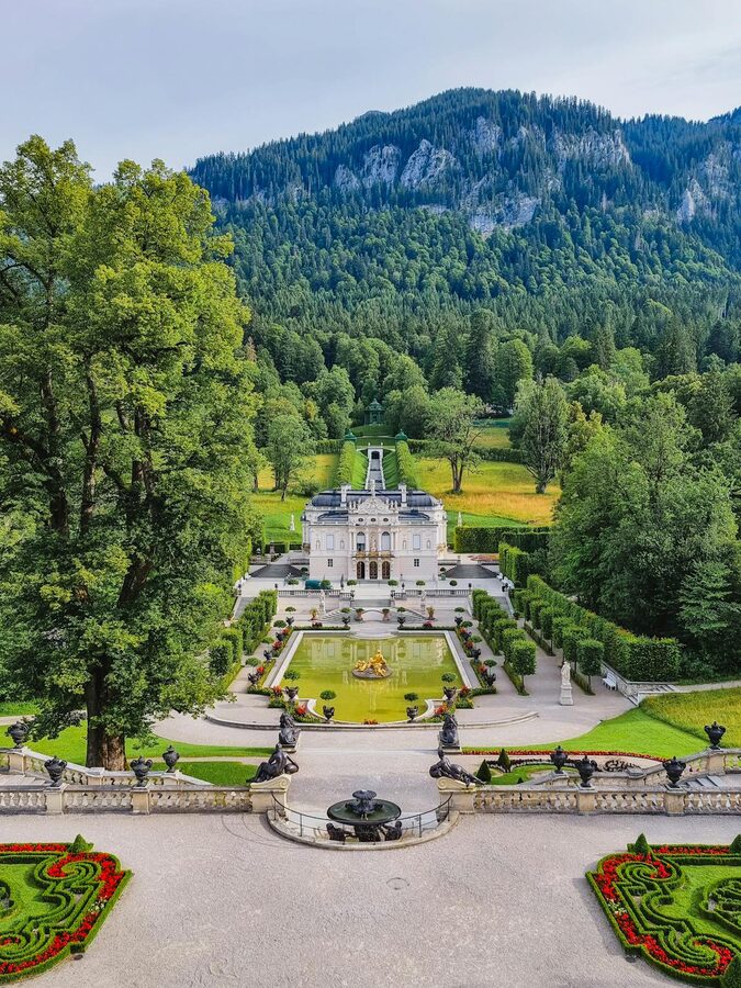 Linderhof Palace surrounded by lush greenery in Bavaria Germany