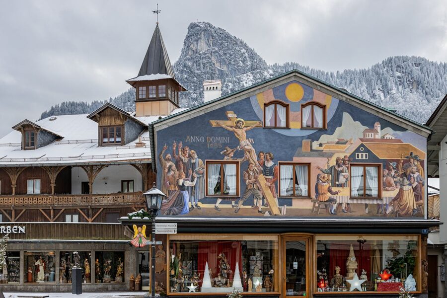 Colorful religious mural on a building in snowy Oberammergau Bavaria Germany