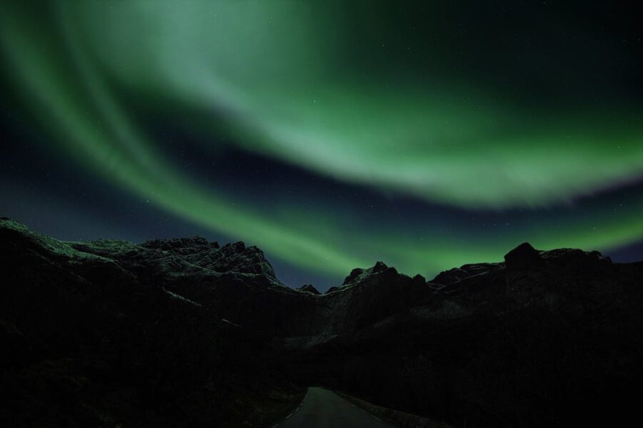 Dramatic aurora borealis with purple and green swirls
