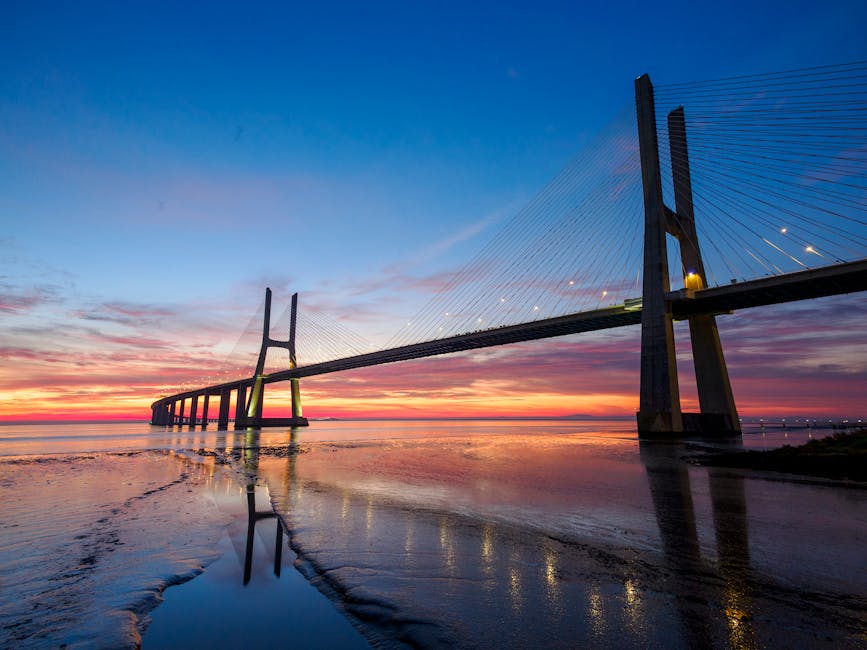 Vasco da Gama Bridge sunset reflecting in Tagus river
