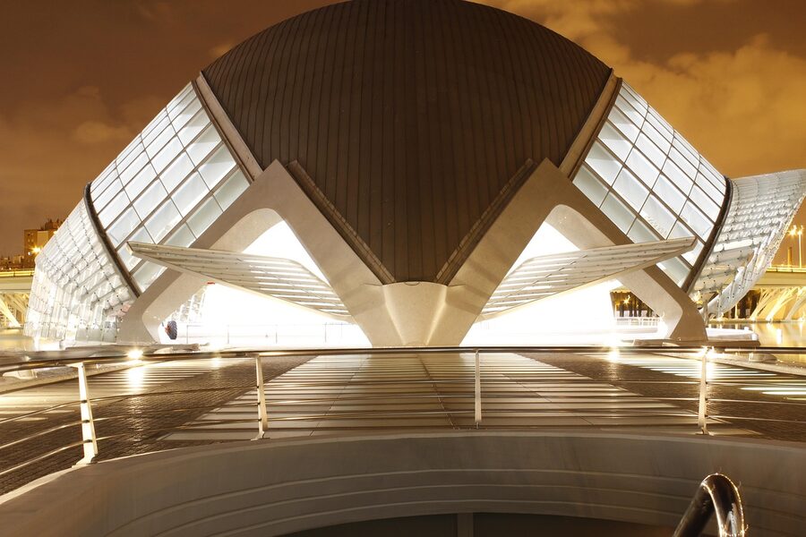 Hemisferic at night reflected in the pool at Valencia City of Arts