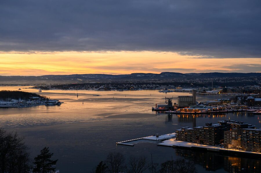 Aerial sunset view of Oslo fjord with city skyline