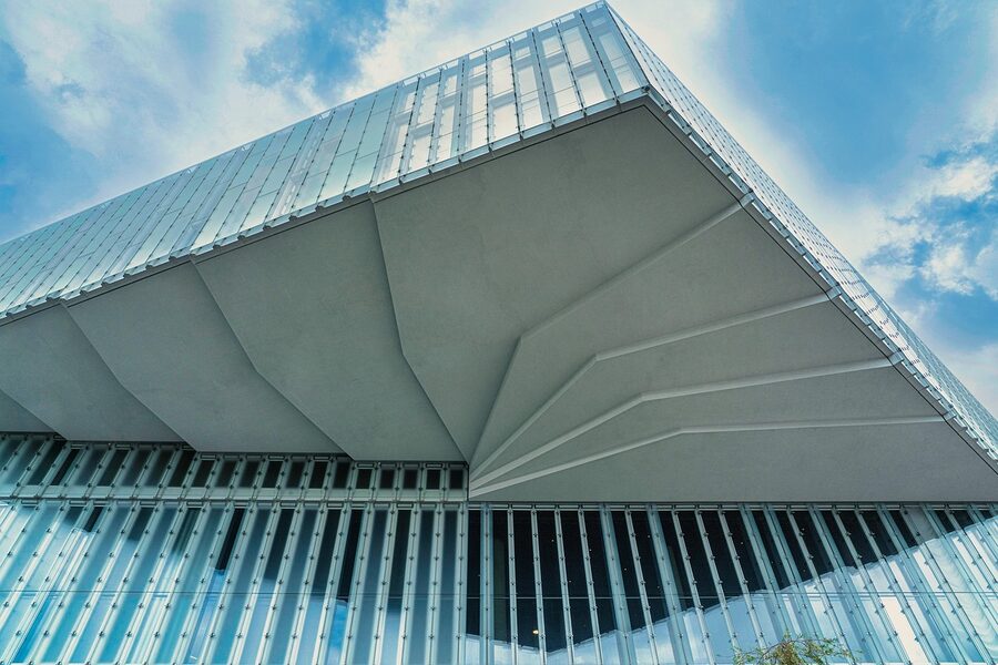 Modern Oslo building with cloud reflections on glass