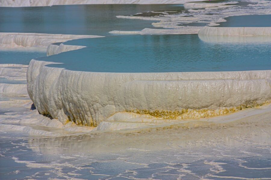 Terraced natural hot springs at Pamukkale Turkey with white mineral deposits