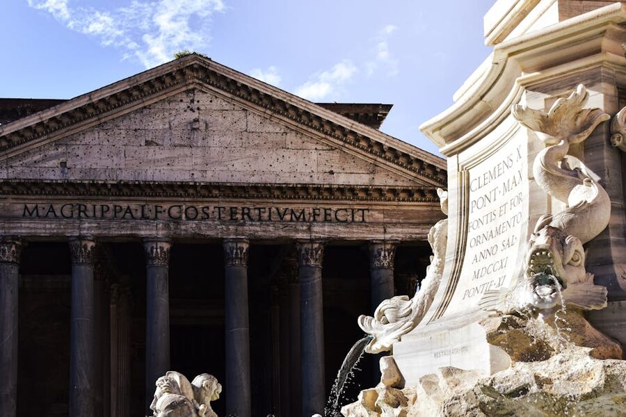 Pantheon facade with fountain under clear sky Rome