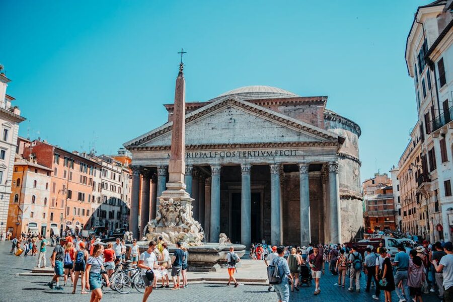 Tourists exploring the Pantheon on a sunny day in Rome