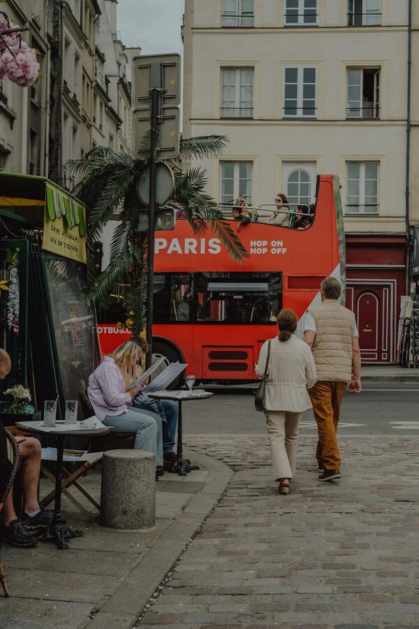 A red Paris hop-on hop-off bus