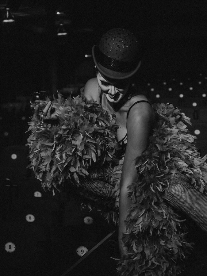 A cabaret performer in feathered costume