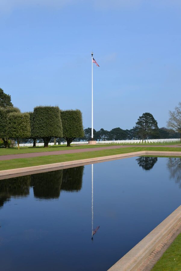 American flag and reflecting pool at the Normandy American Cemetery memorial