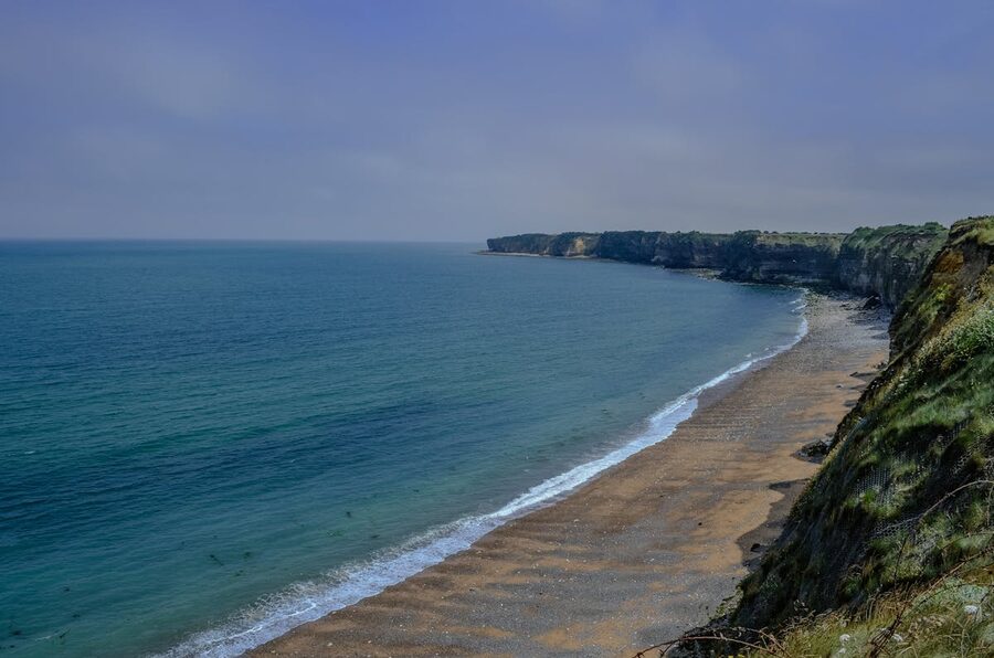 Cliffs and beach at Pointe du Hoc viewed from the shore level
