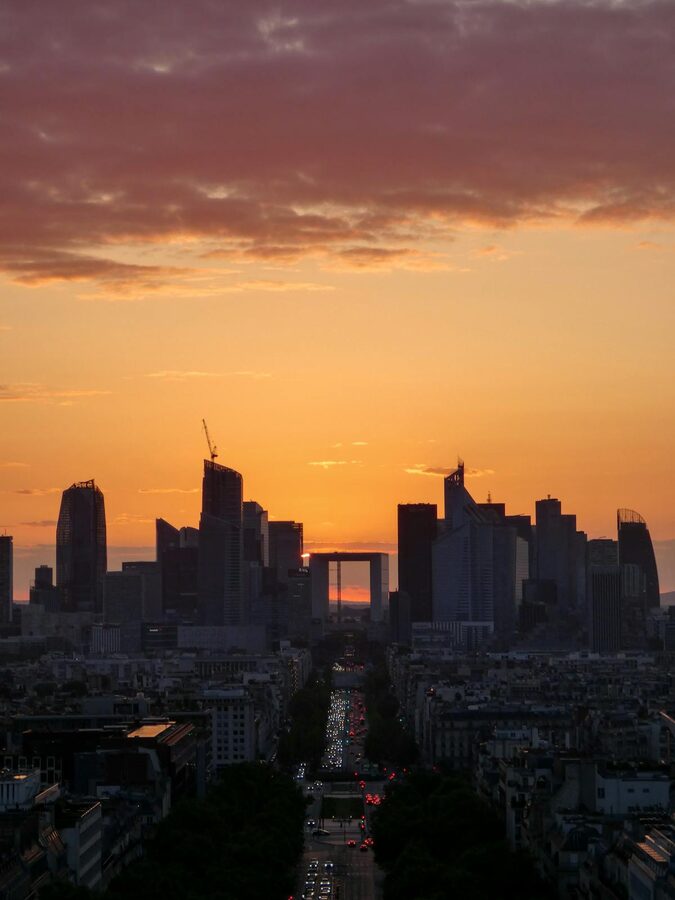 La Défense skyline at sunset with orange and purple sky
