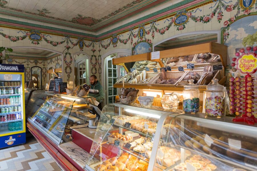 Elegant Parisian bakery with display cases of fresh baked goods