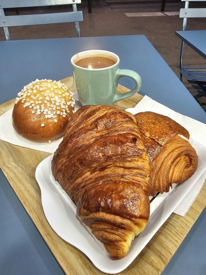 French pastries and coffee on a café table in Paris