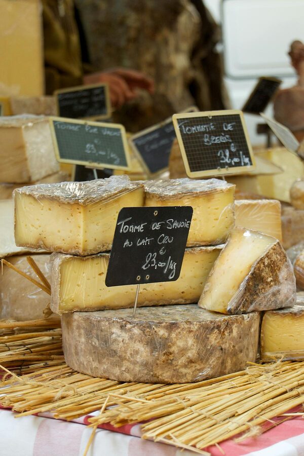 Display of French cheeses at an outdoor market